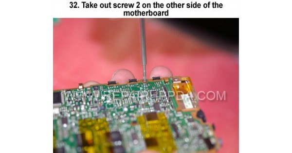32. Take out screw 2 on the other side of the motherboard